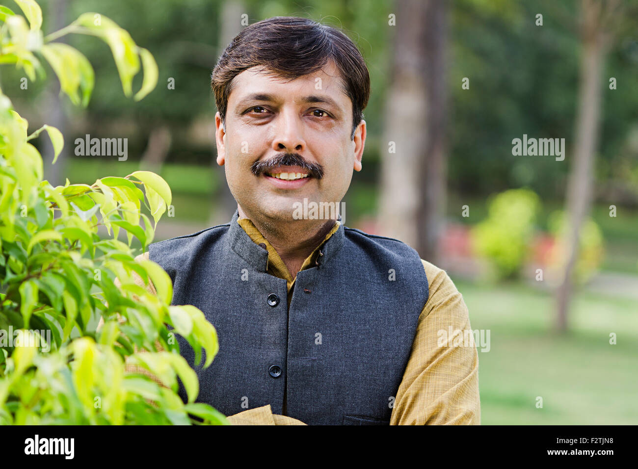 1 indian Adult Man standing Garden Stock Photo - Alamy