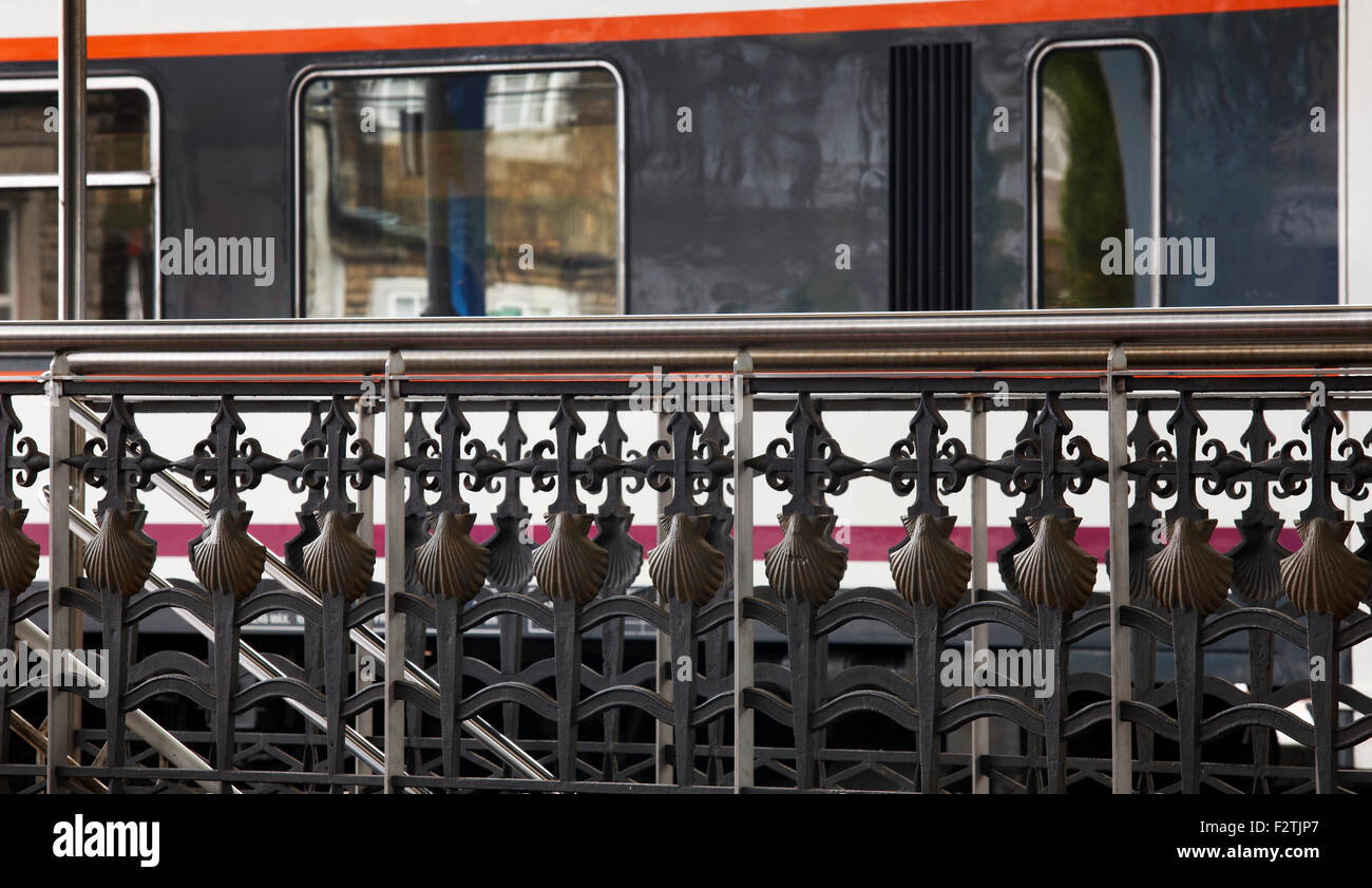 Handrail on an old train station with train Stock Photo - Alamy