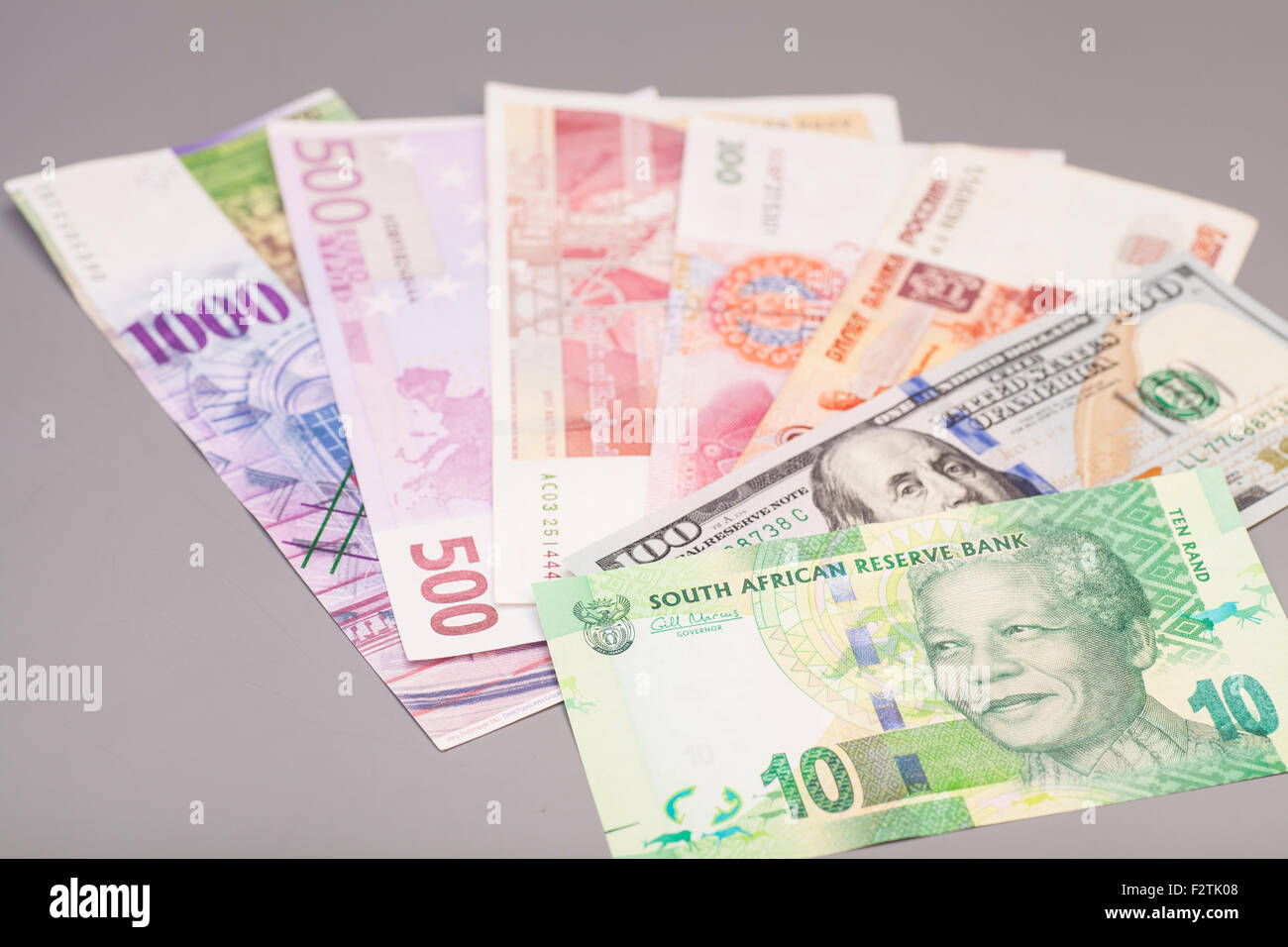 International currencies isolated on gray backgrond Stock Photo - Alamy