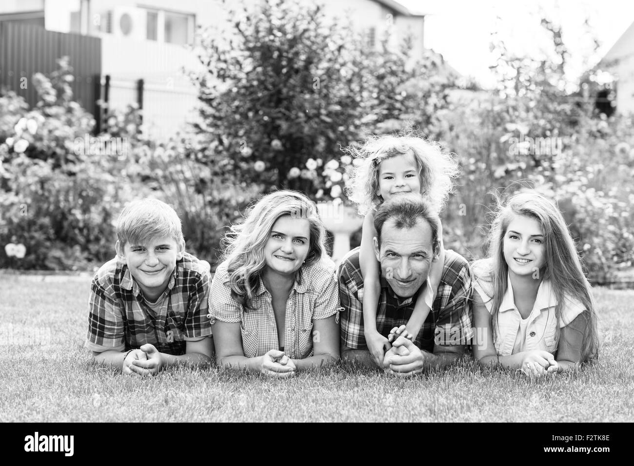 Happy family having weekend in summer park Stock Photo - Alamy