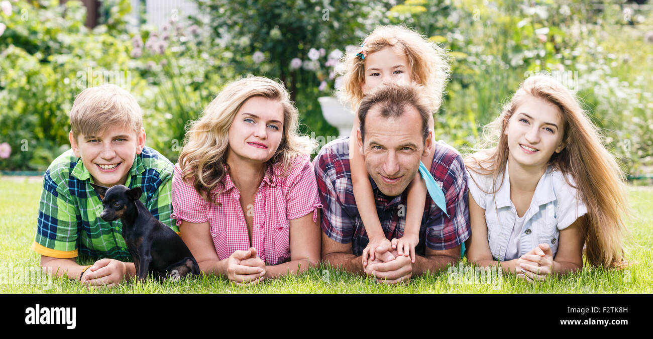 Happy family having weekend in summer park Stock Photo - Alamy