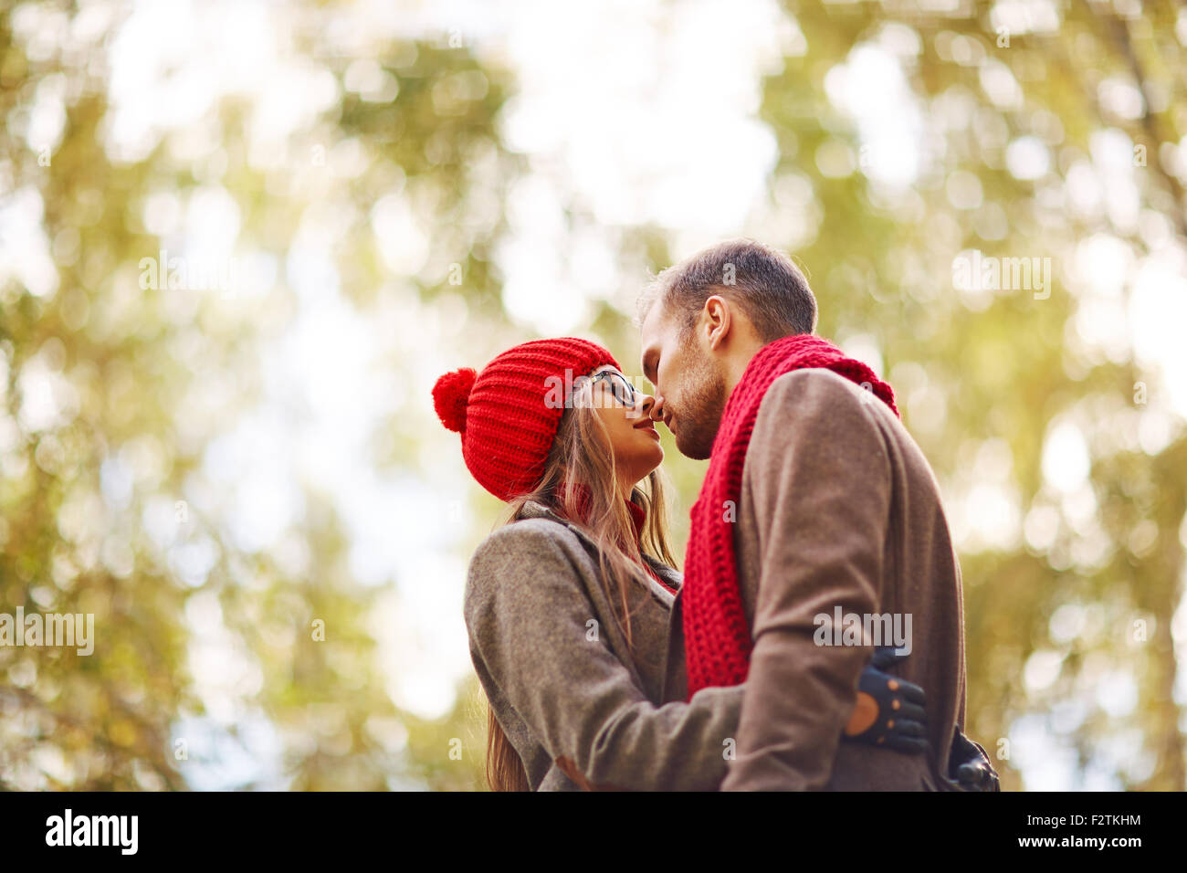 Amorous couple embracing in park Stock Photo - Alamy