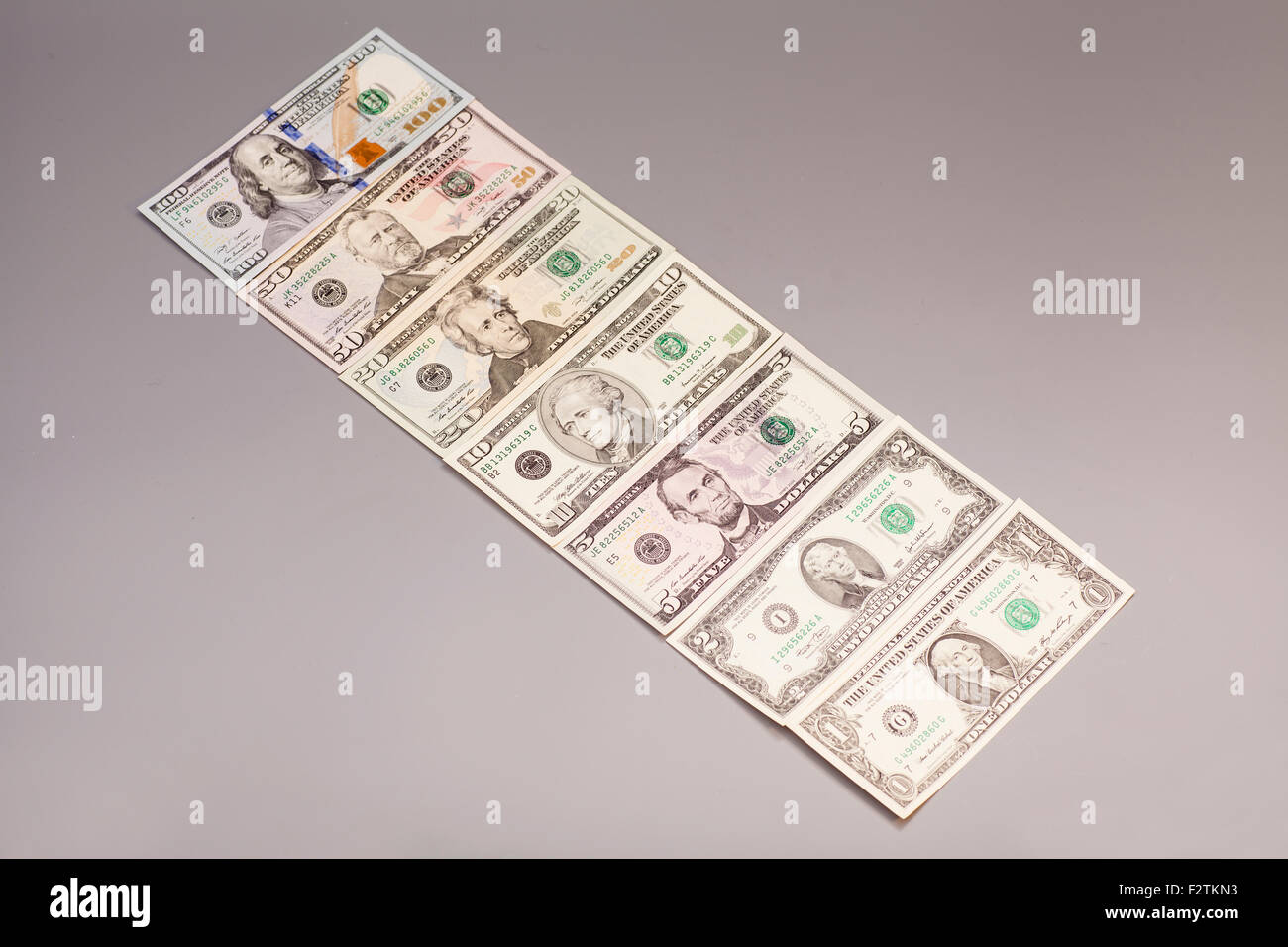 Money American dollar bills isolated on gray Stock Photo - Alamy