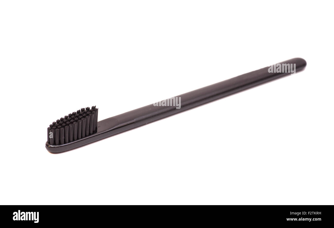 Black toothbrush on white background Stock Photo - Alamy