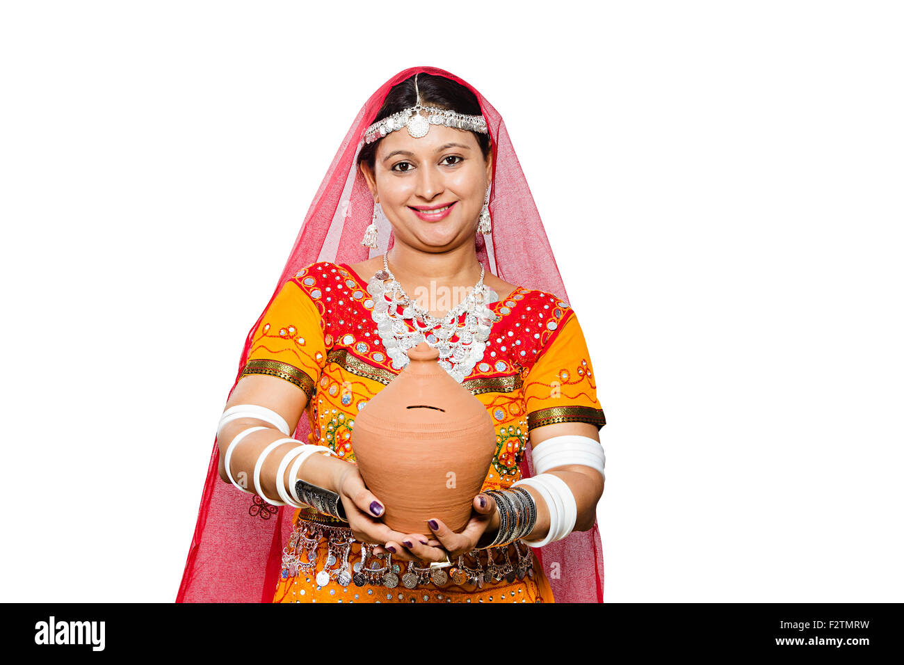 1 indian Rajasthani Villager Adult Woman Piggy Bank saving money Stock ...