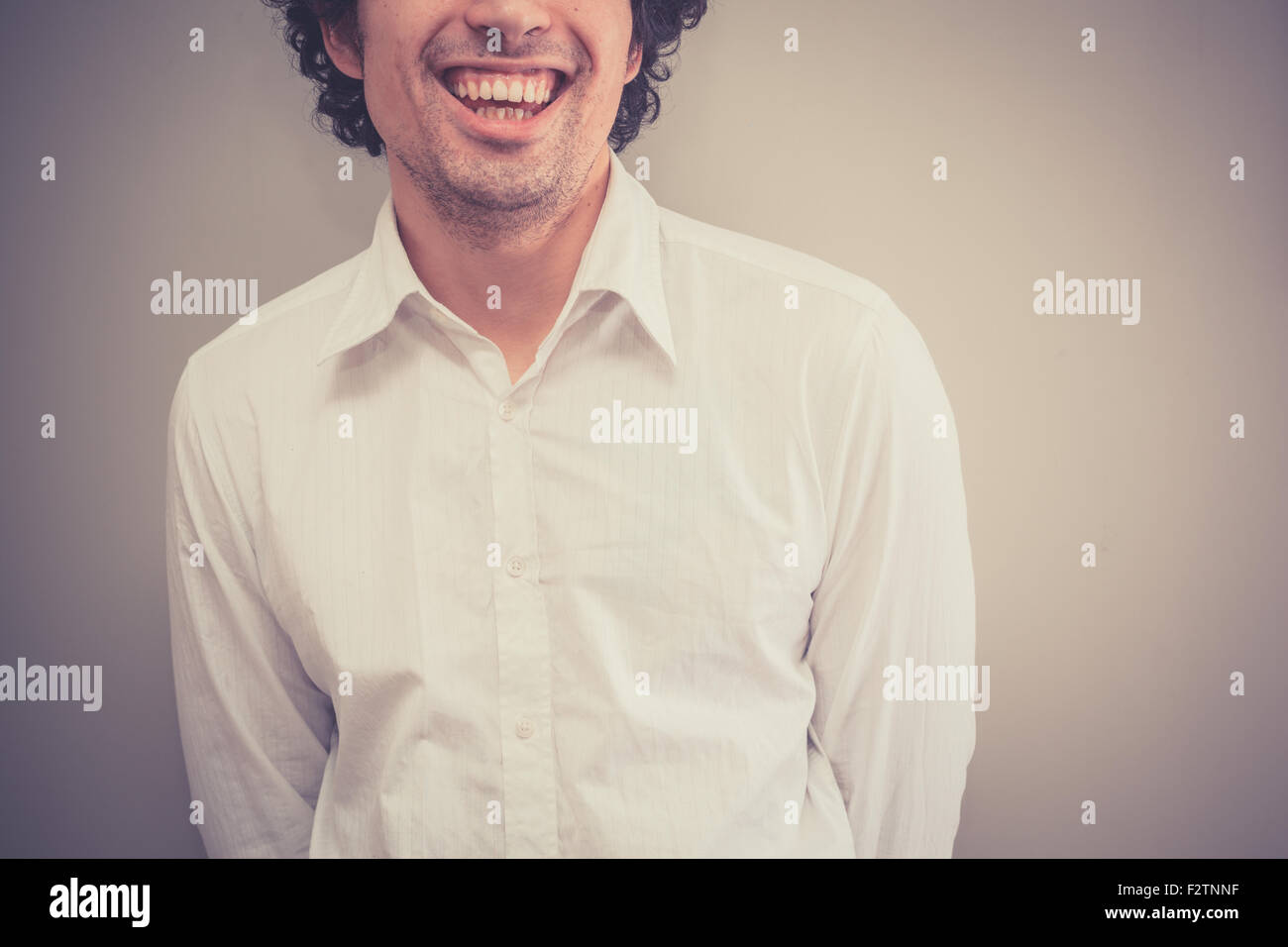 Smiling young man is happy Stock Photo - Alamy