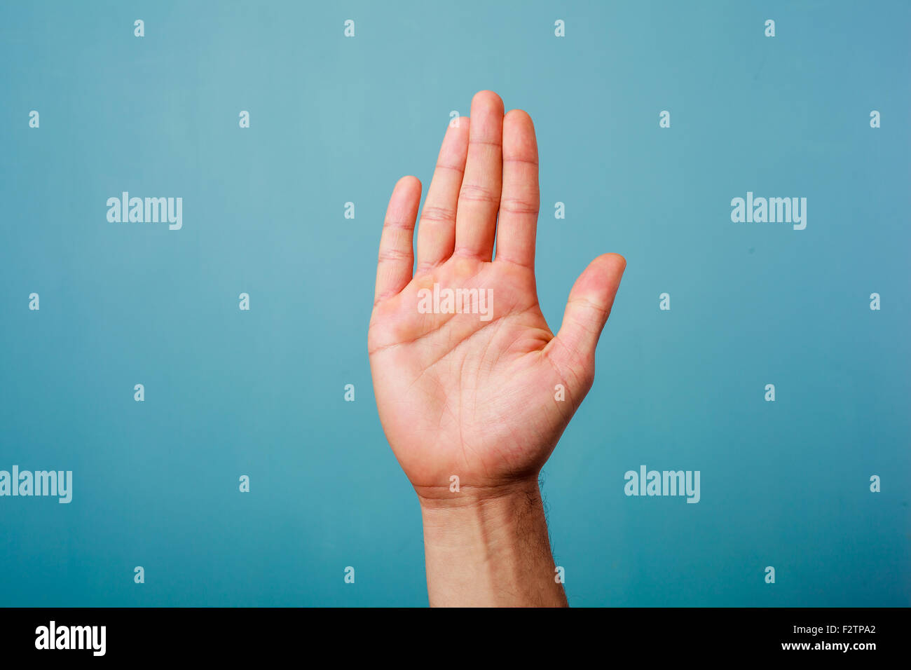 Raised hand attention hi-res stock photography and images - Alamy