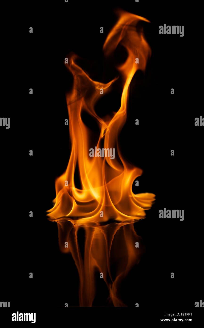 Beautiful stylish fire flames reflected in water Stock Photo - Alamy