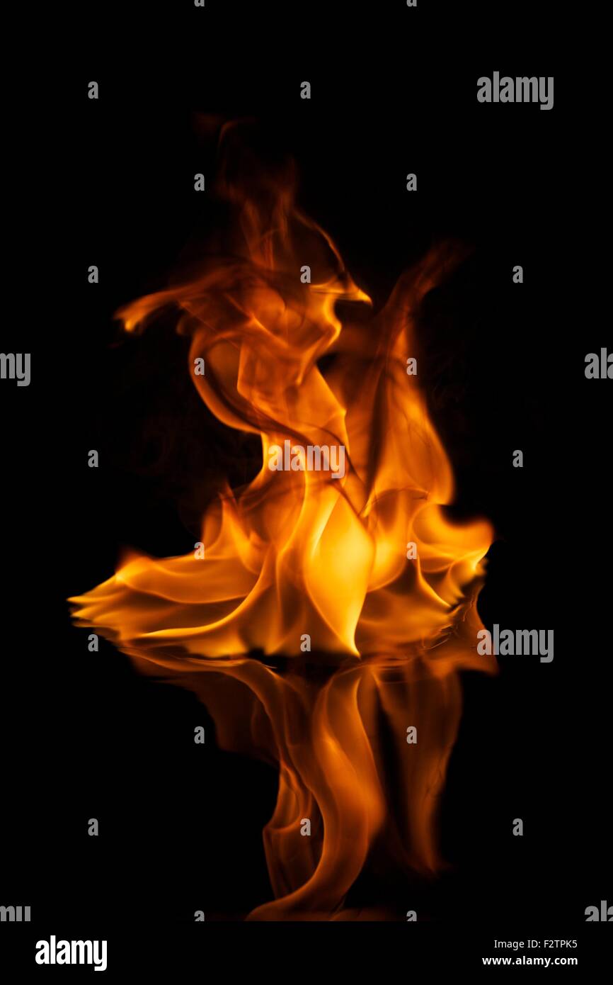 Beautiful stylish fire flames reflected in water Stock Photo - Alamy