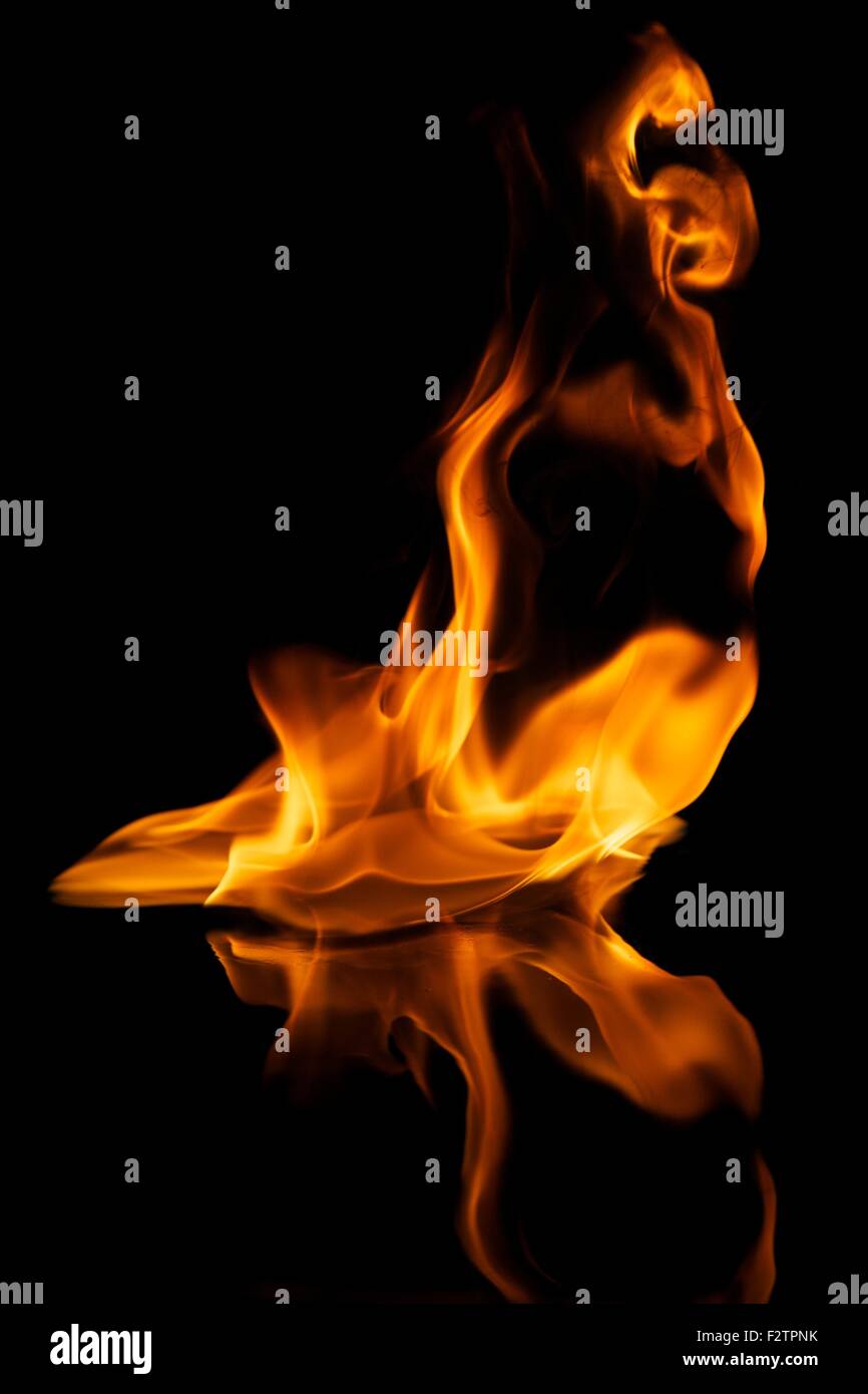 Fire flames reflected in water Stock Photo - Alamy