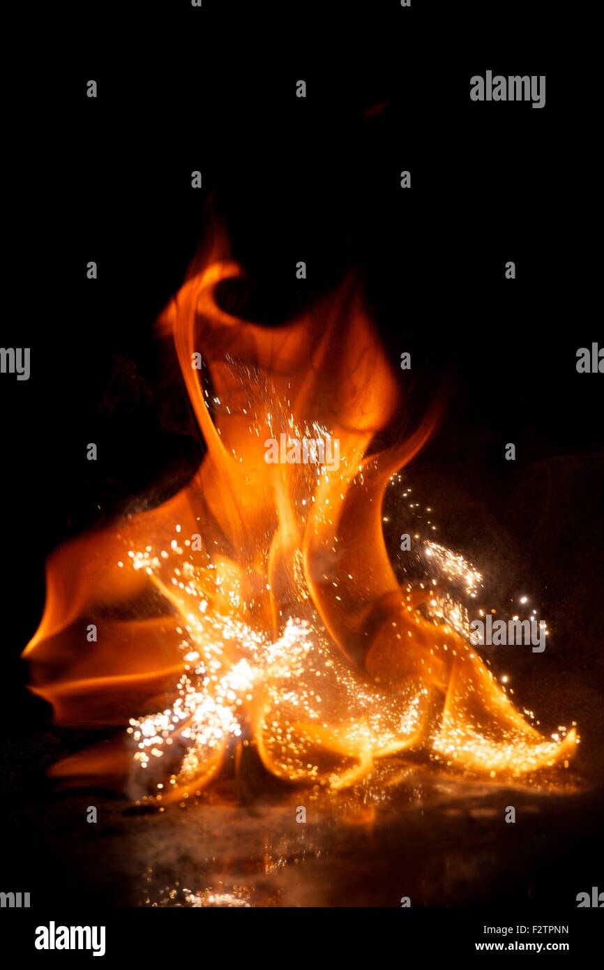 Fire flames reflected in water Stock Photo - Alamy