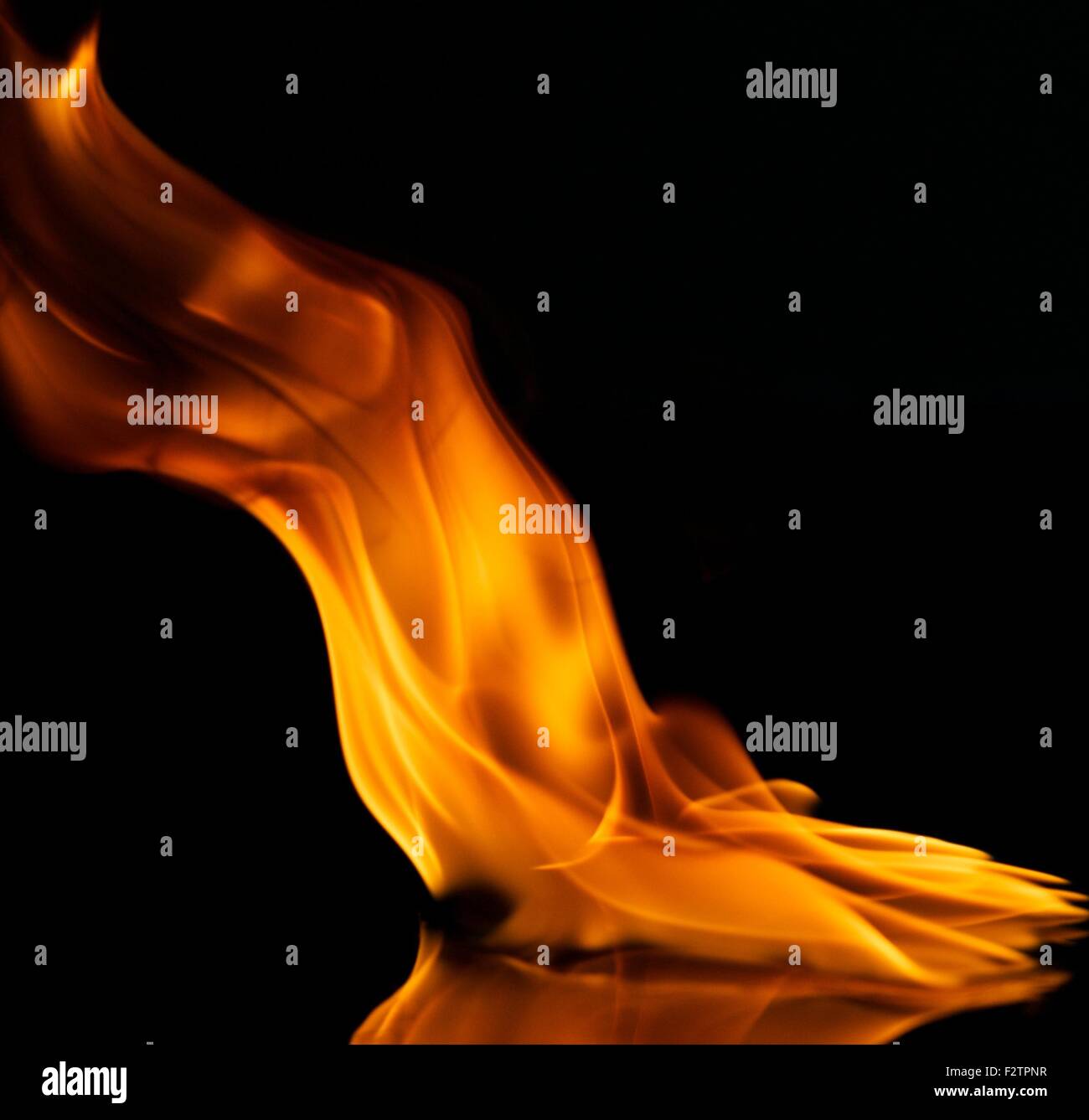 Fire flames reflected in water Stock Photo - Alamy