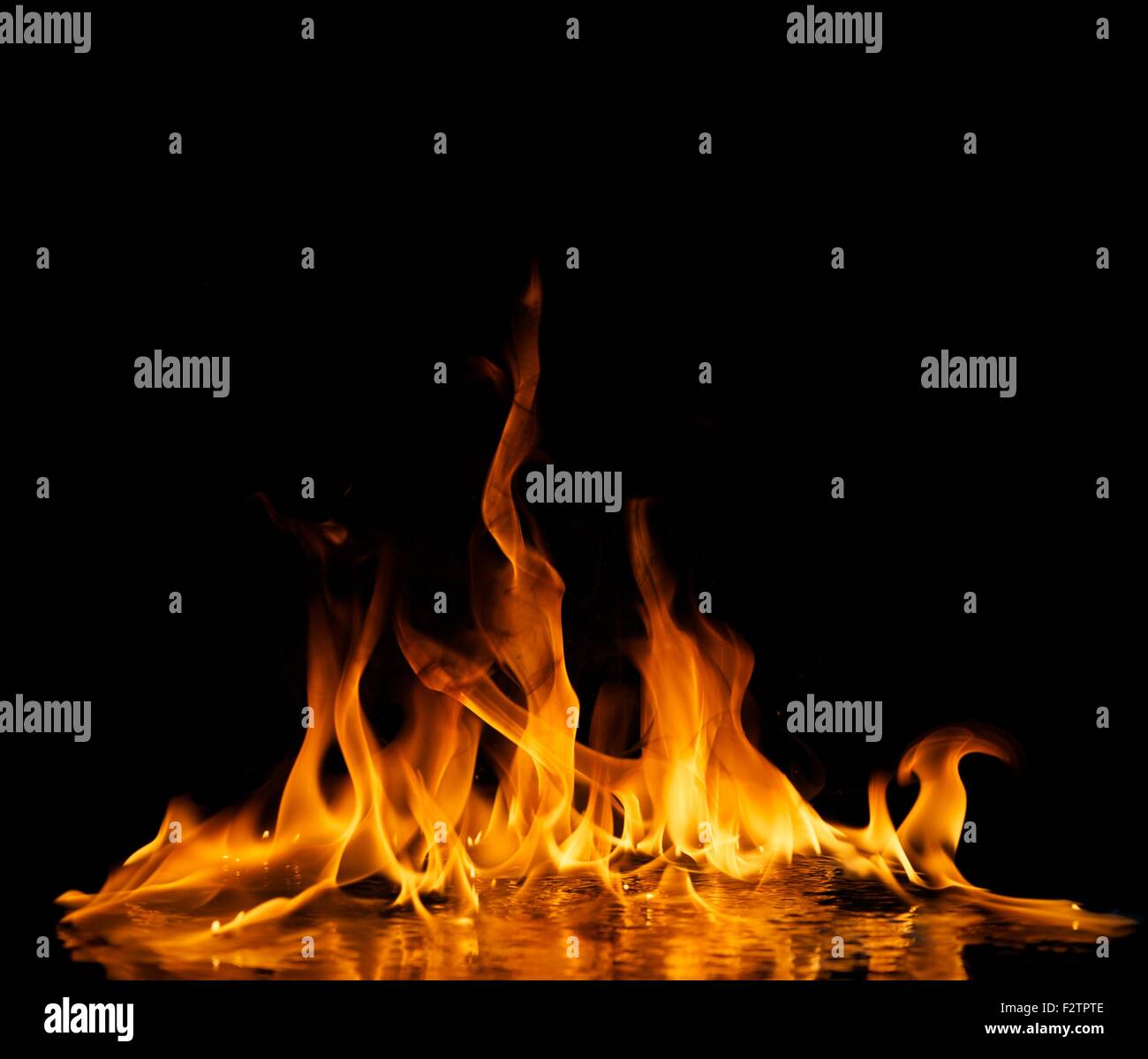 Fire flames reflected in water Stock Photo - Alamy
