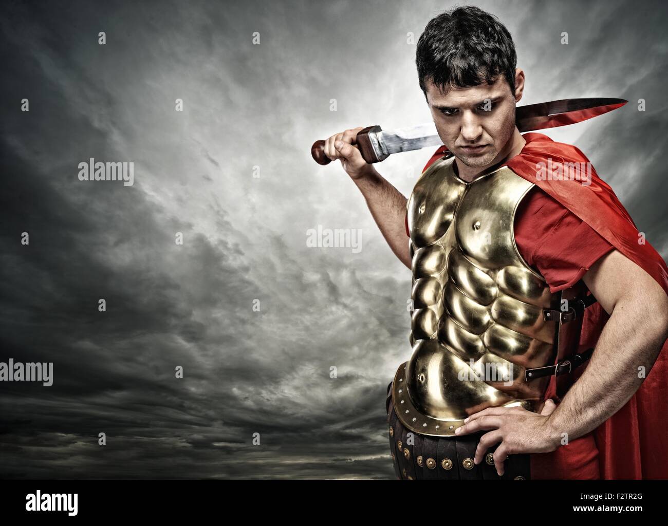 Legionary soldier over stormy sky Stock Photo - Alamy