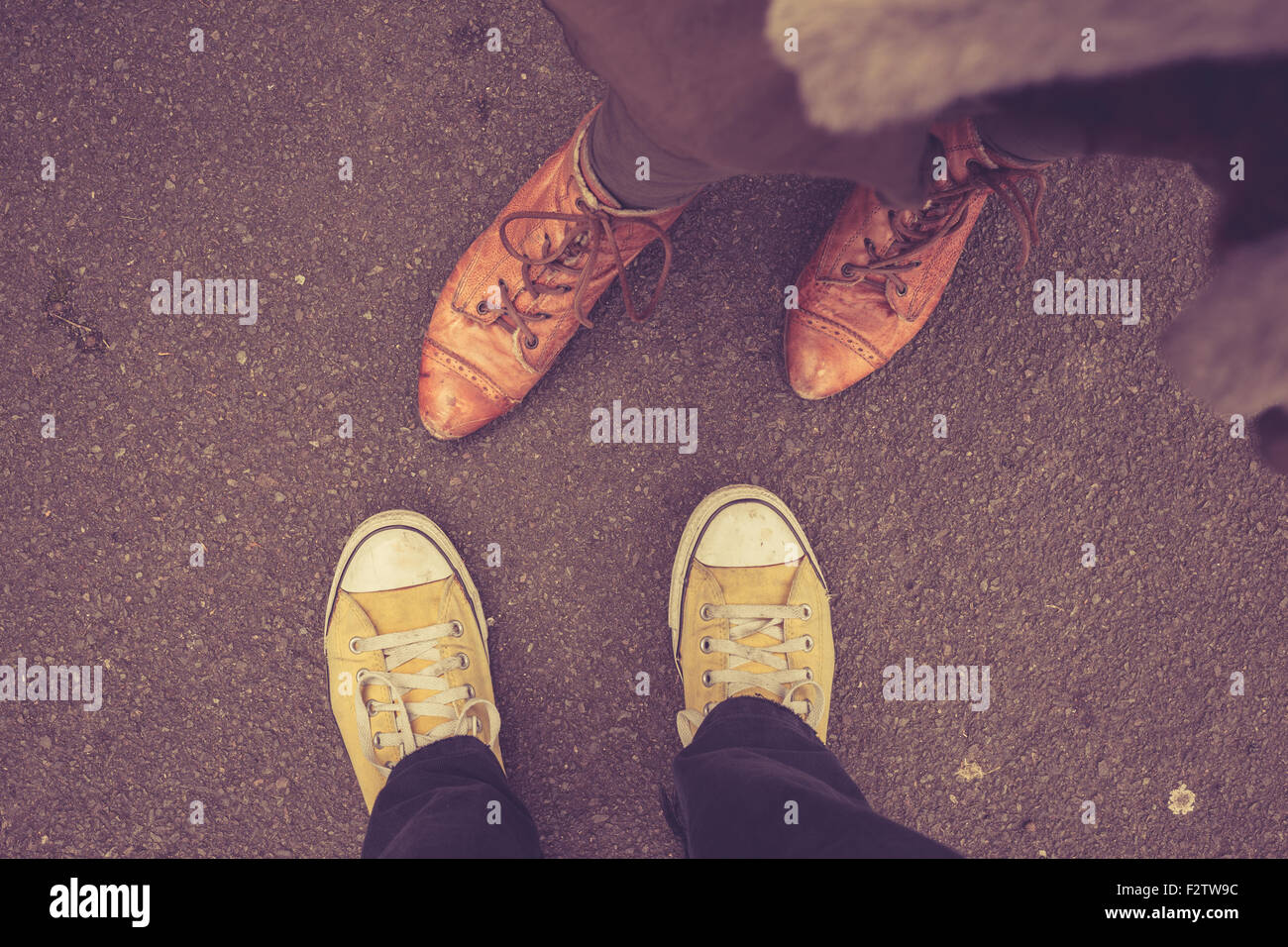 A man and a woman's feet as they're standing opposite each other Stock ...