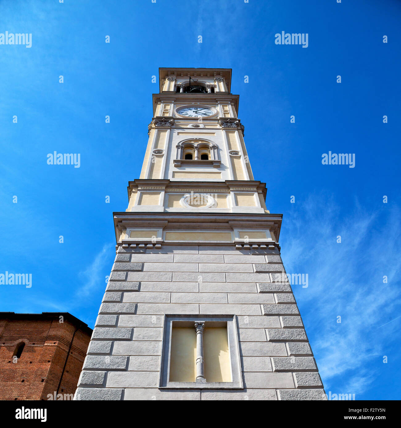 ancien clock tower in italy europe old stone and bell Stock Photo - Alamy