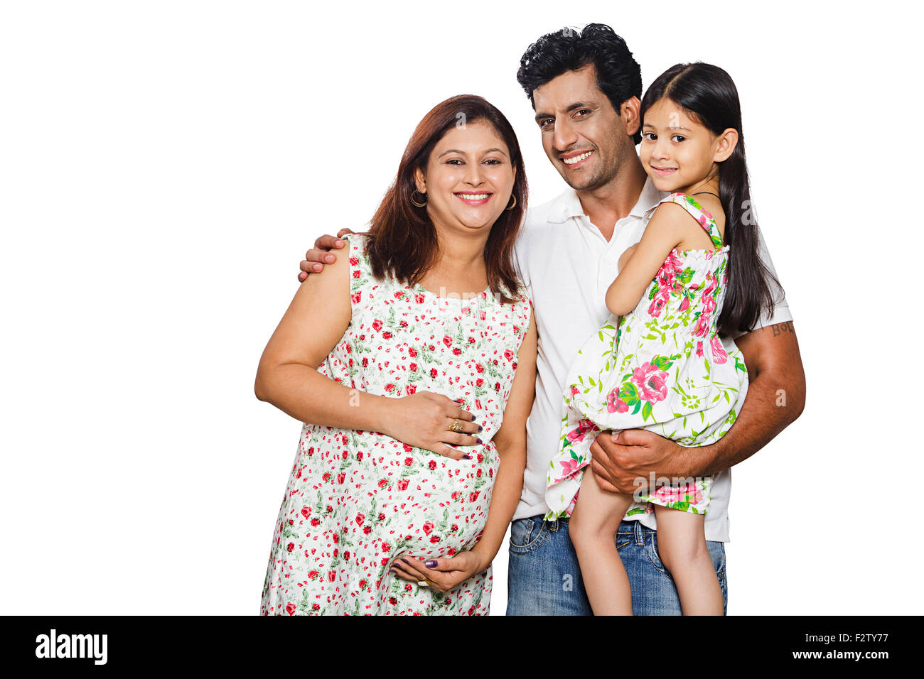 3 indian mother Pregnant and daughter with father standing Stock Photo ...
