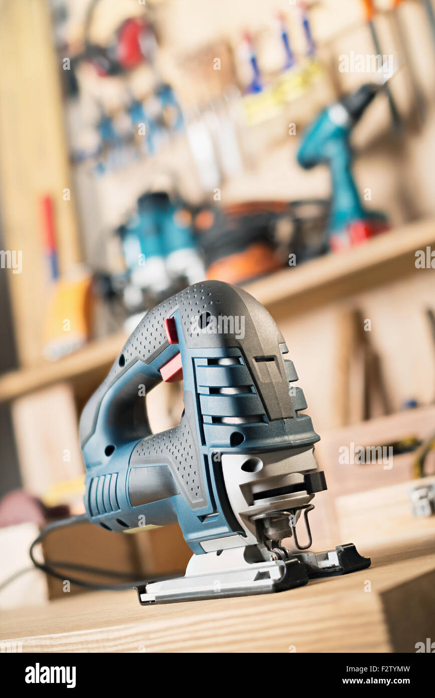 Jigsaw on the table in a carpentry workshop or garage Stock Photo - Alamy
