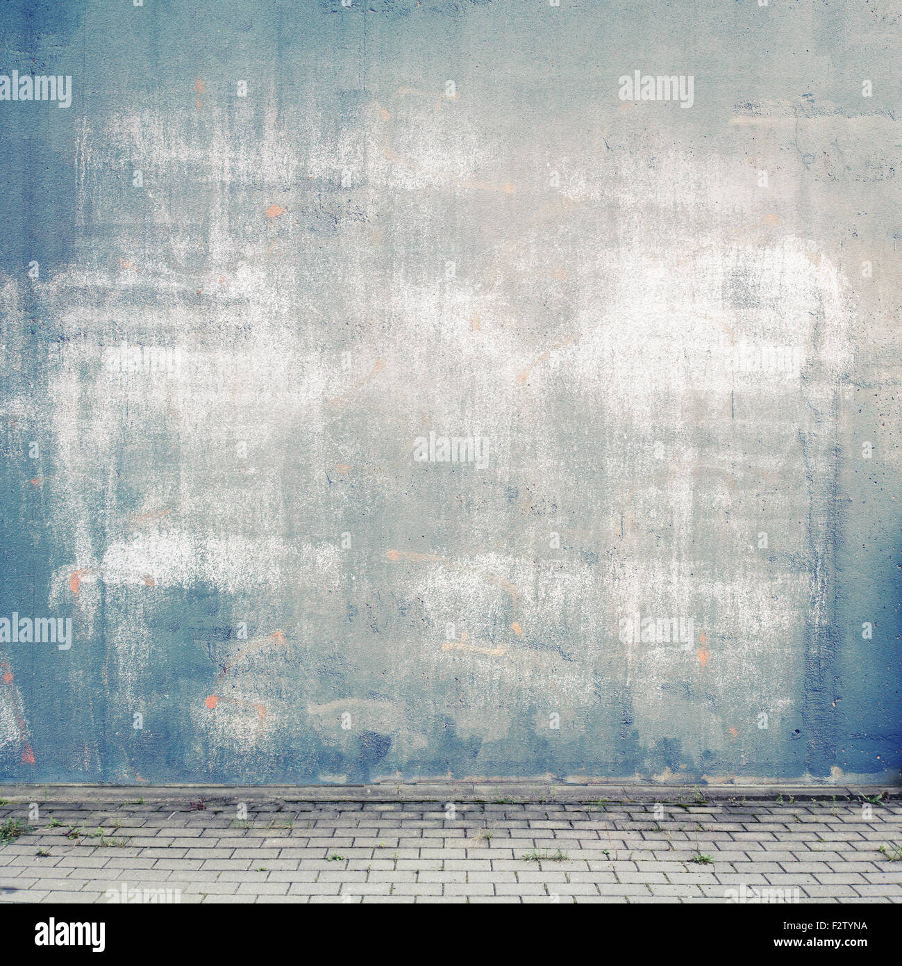 Urban background. Grunge obsolete street wall and pavement Stock Photo ...