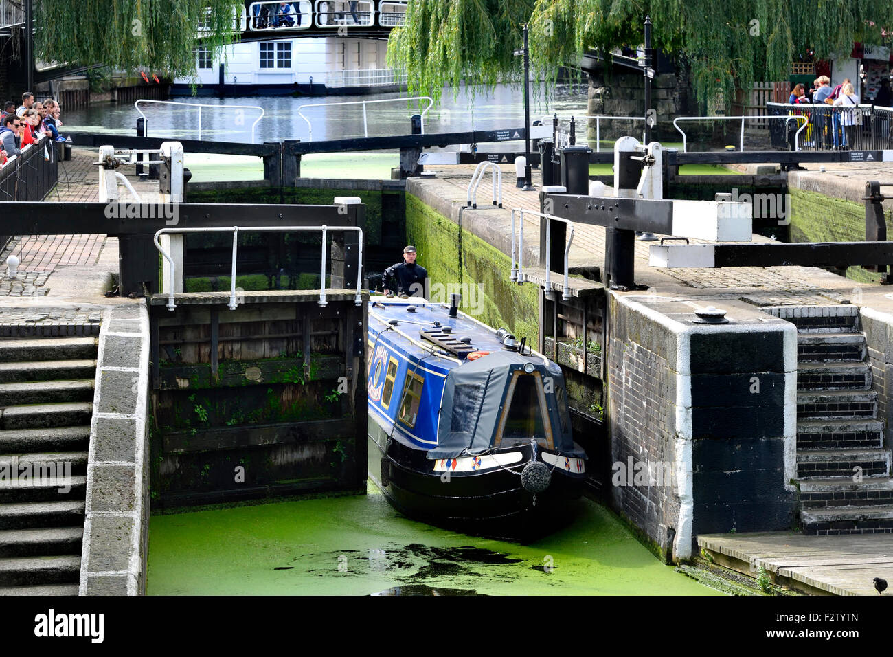 London, England, UK. Narrowboat passing through Camden lock Stock Photo ...
