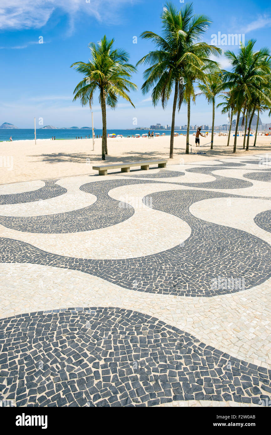 Iconic sidewalk tile pattern with palm trees at empty view of ...