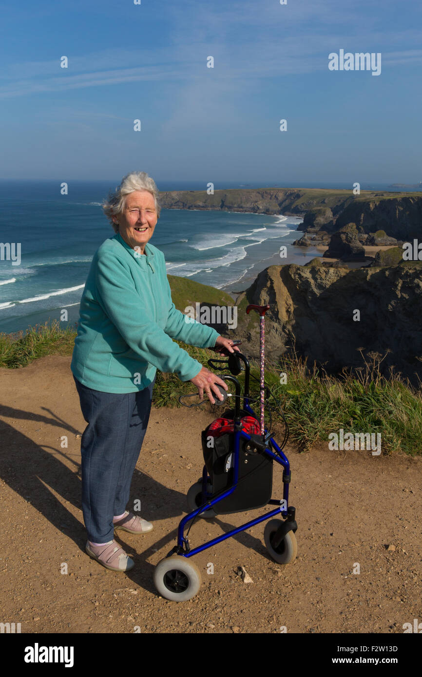Active old lady pensioner with three wheel trolley mobility aid by ...
