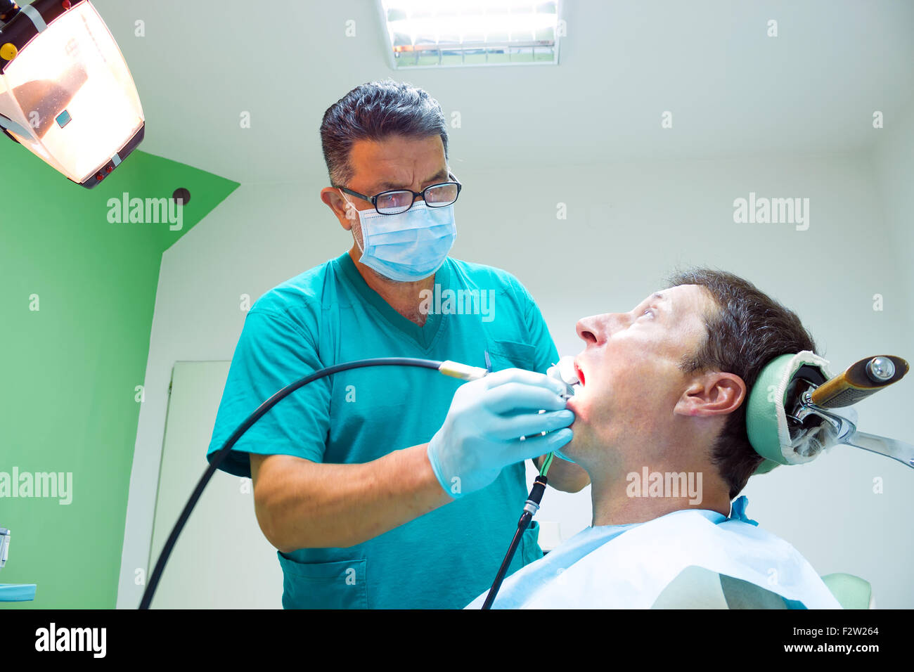 Mending patient's teeth Stock Photo - Alamy