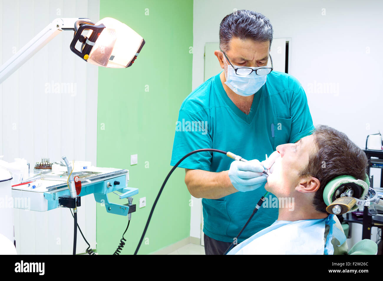 Mending patient's teeth Stock Photo - Alamy