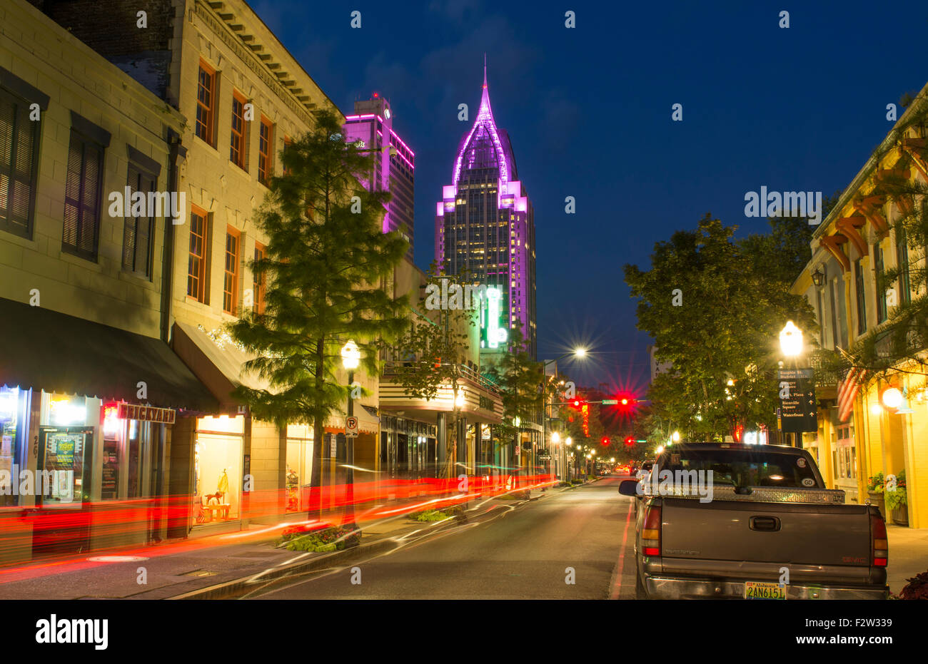 Mobile Alabama downtown traffic on Dauphin Street at twilight with ...