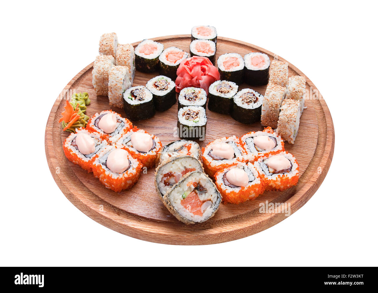 Roll set on wood round table isolated on white Stock Photo - Alamy