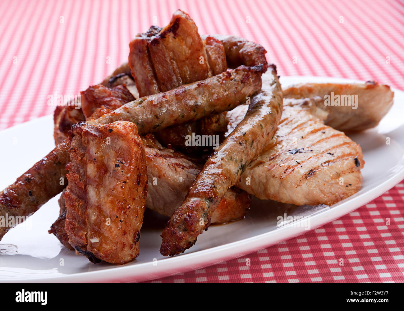 Grilled meat mix with onion Stock Photo - Alamy