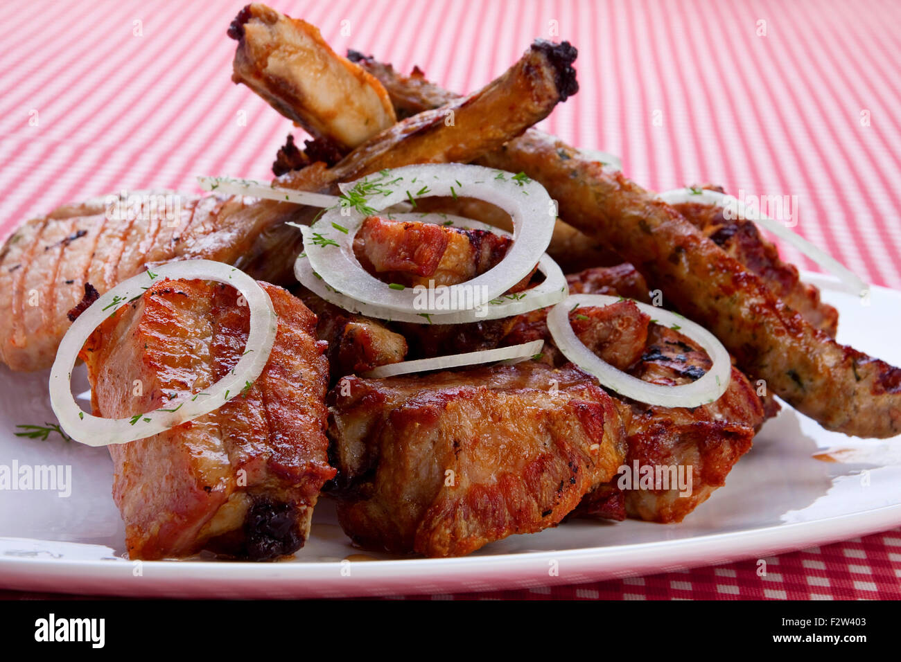 Grilled meat mix with onion Stock Photo - Alamy