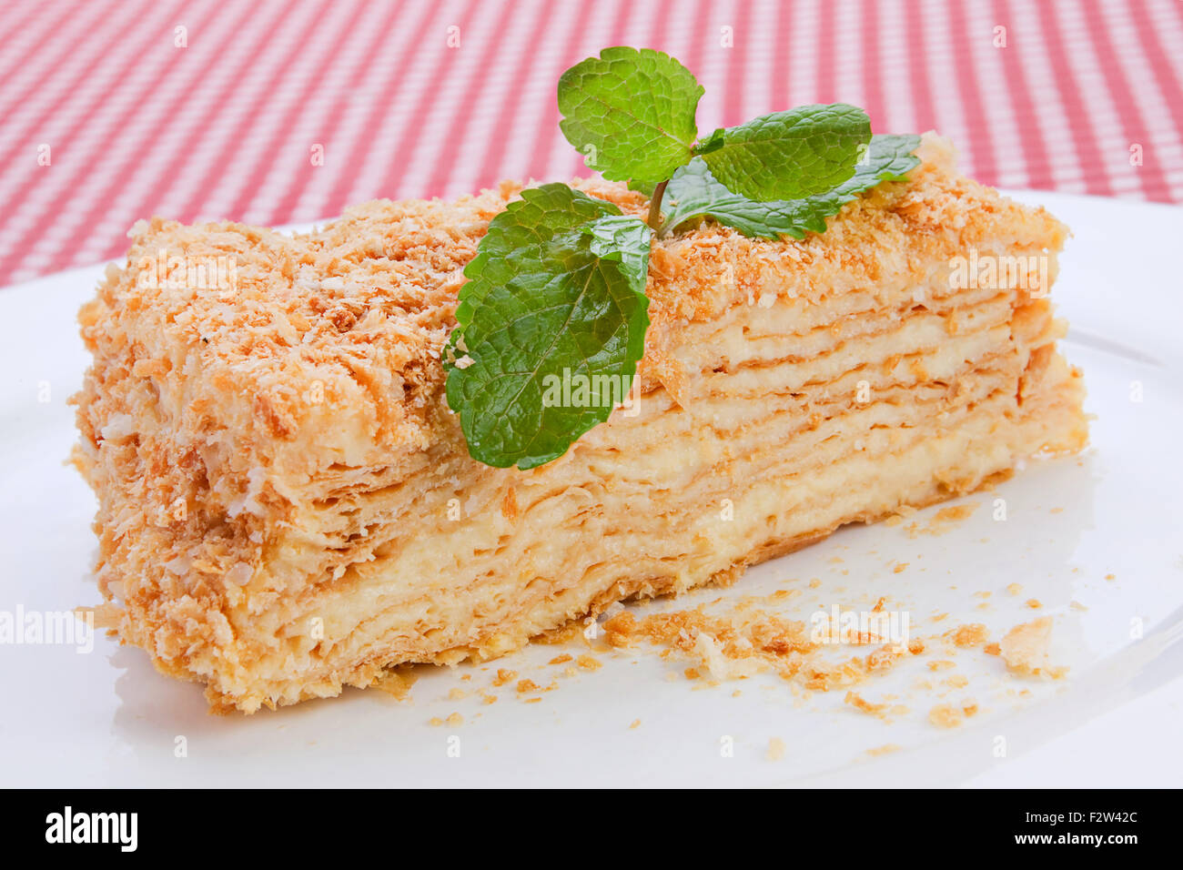 Cake with boiled cream and mint herb Stock Photo - Alamy