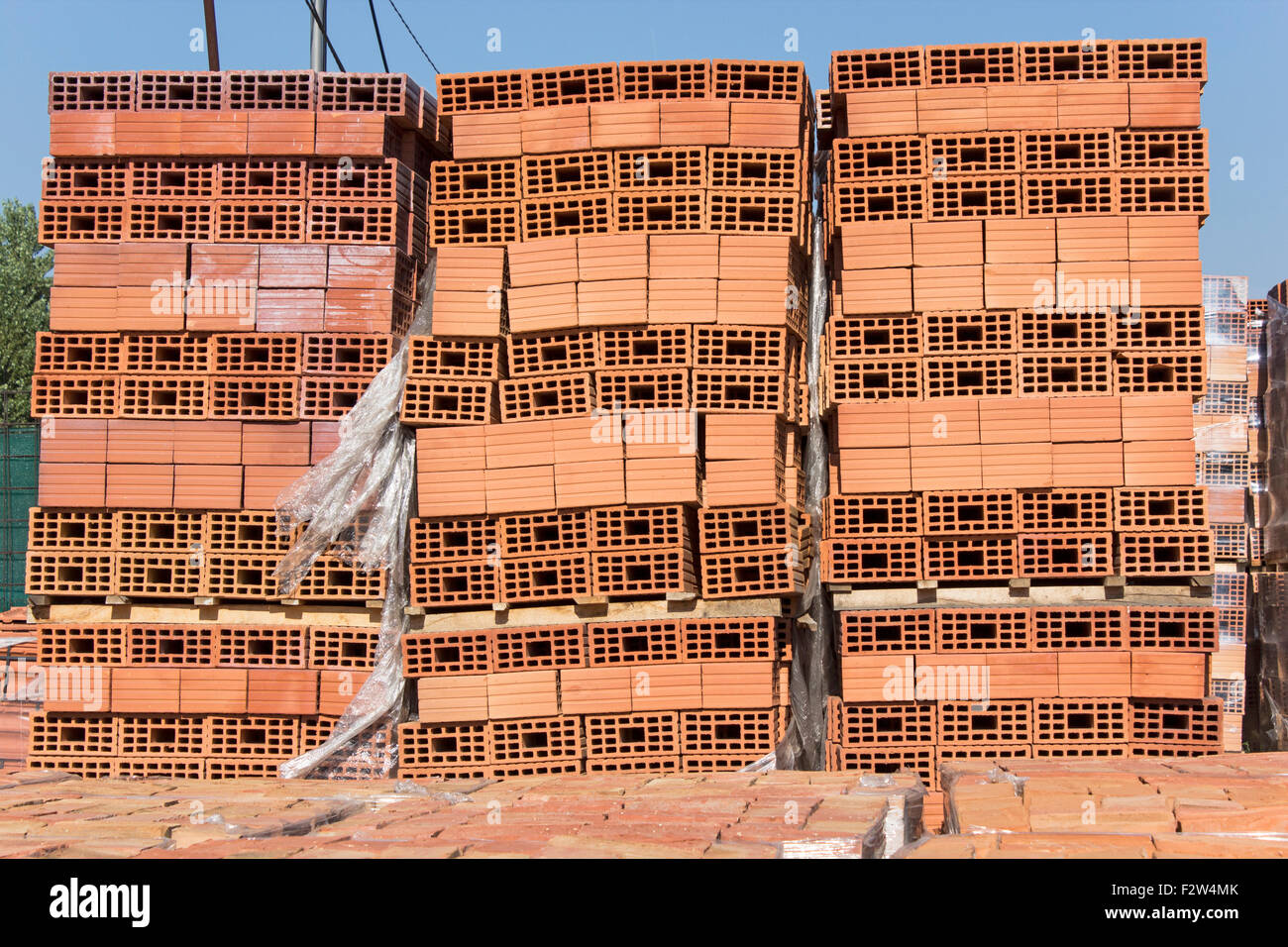 Building blocks stacked on pallets Stock Photo - Alamy