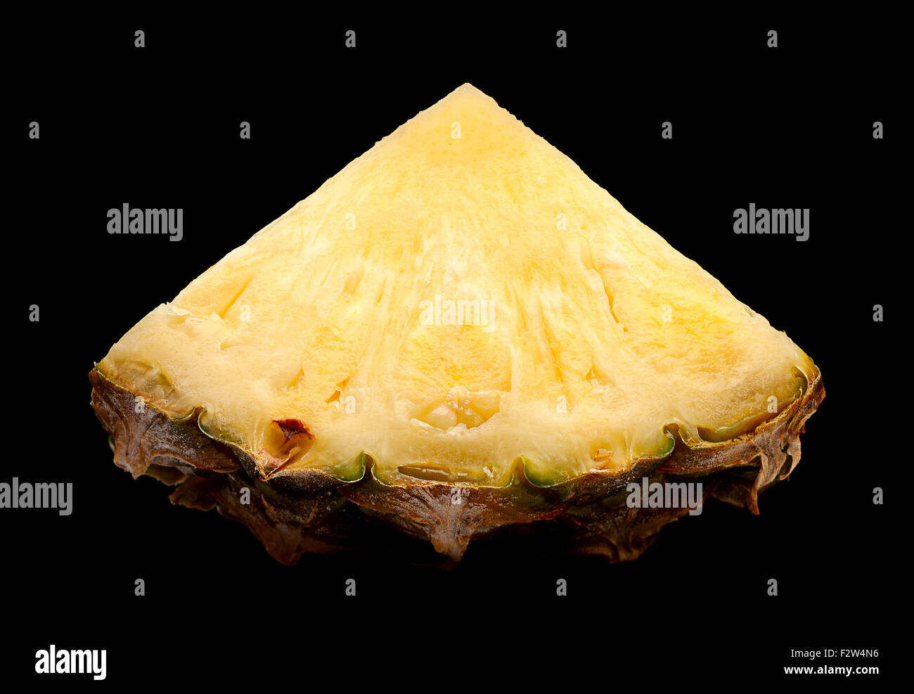 Pineapple fruit closeup isolated on black Stock Photo - Alamy