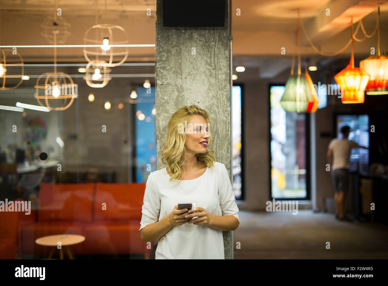 Young woman with mobile phone Stock Photo - Alamy