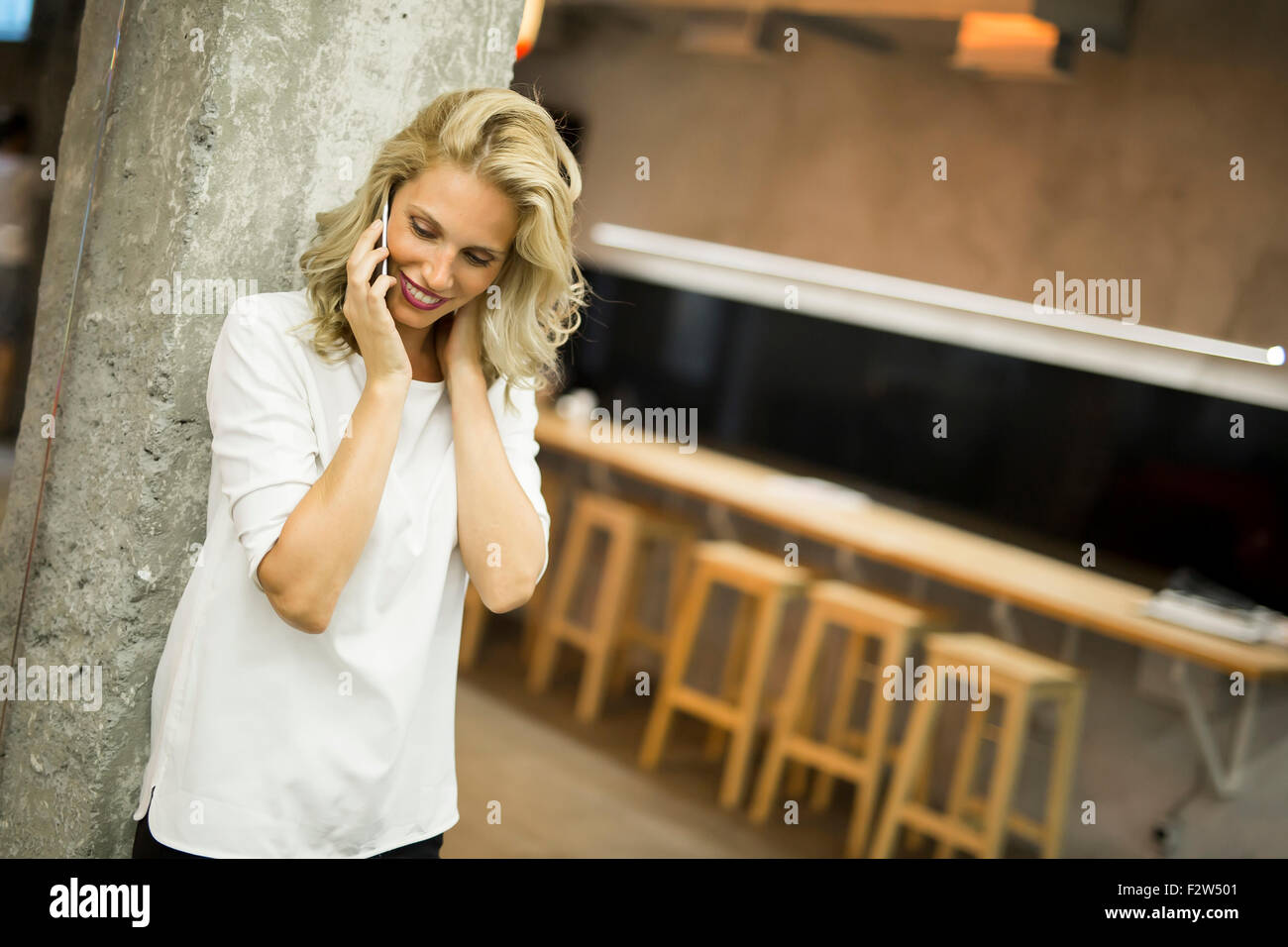 Young woman with mobile phone Stock Photo - Alamy