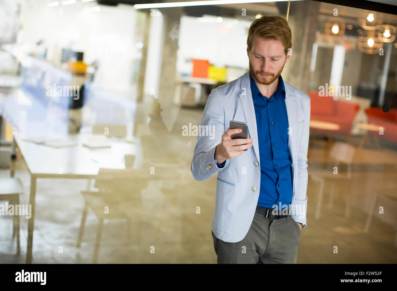 Young man with mobile phone Stock Photo - Alamy