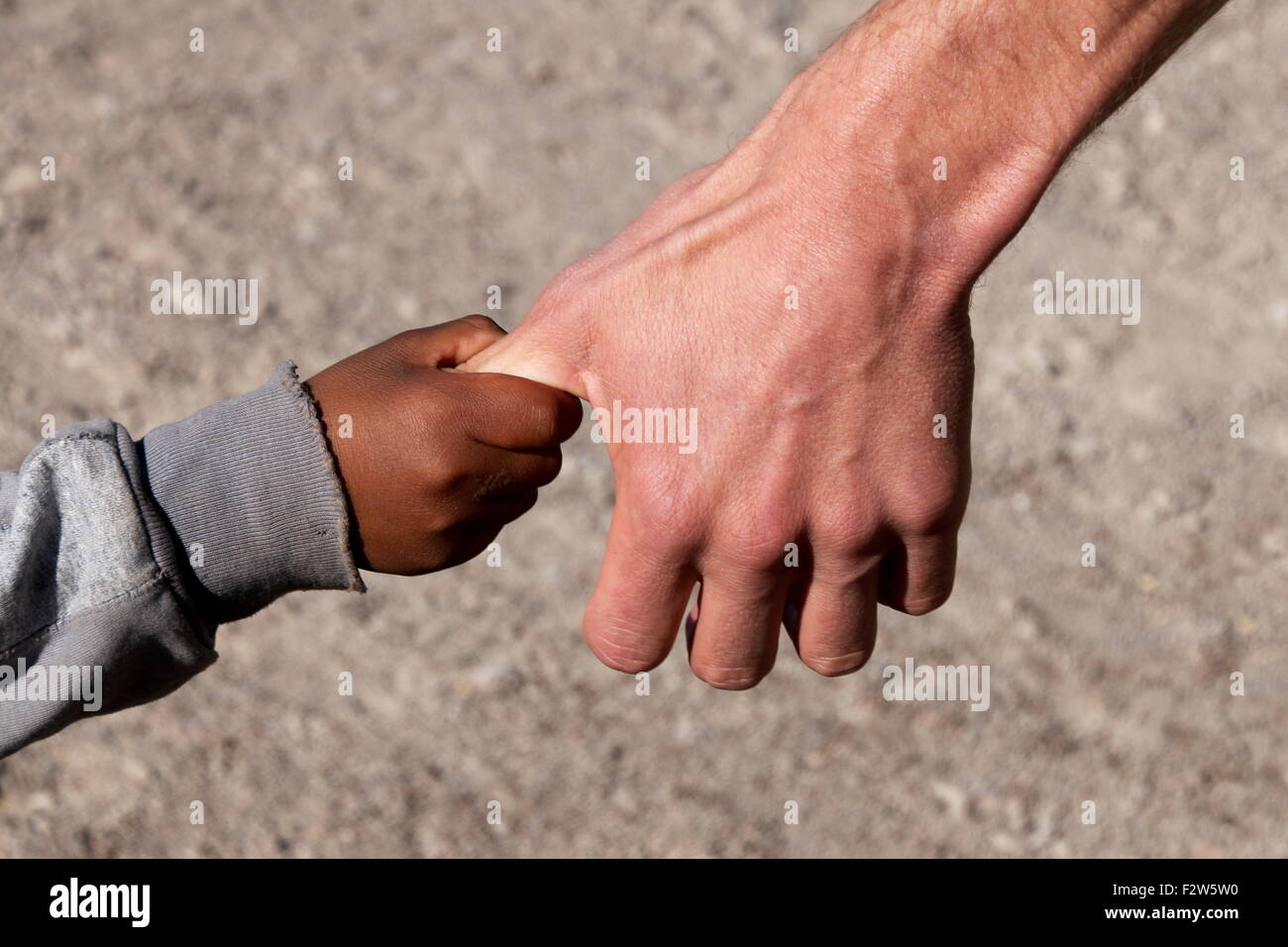 A Refugee child on Hand of a Helper Stock Photo - Alamy
