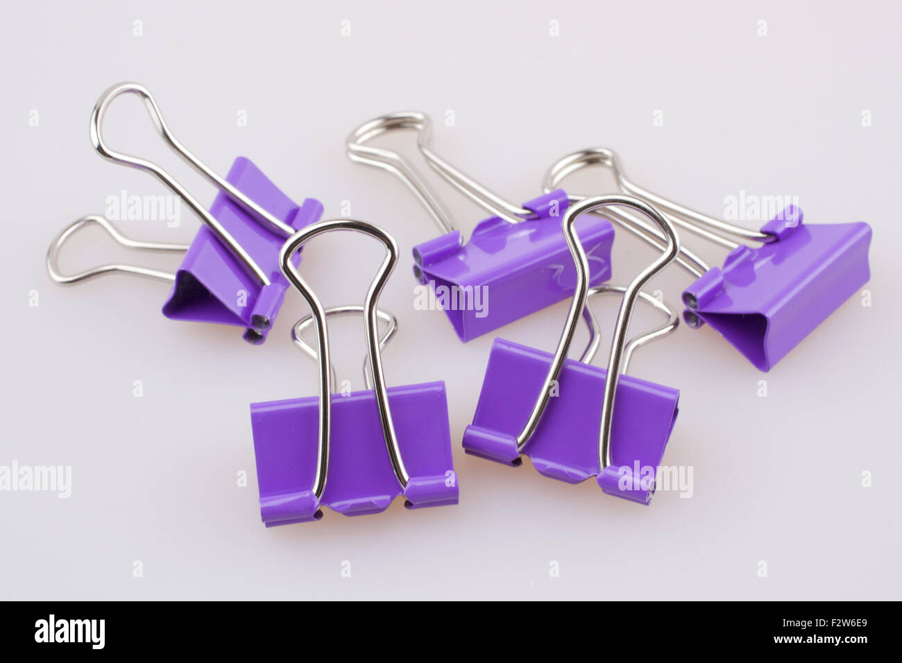 Binder clips on white background Stock Photo - Alamy
