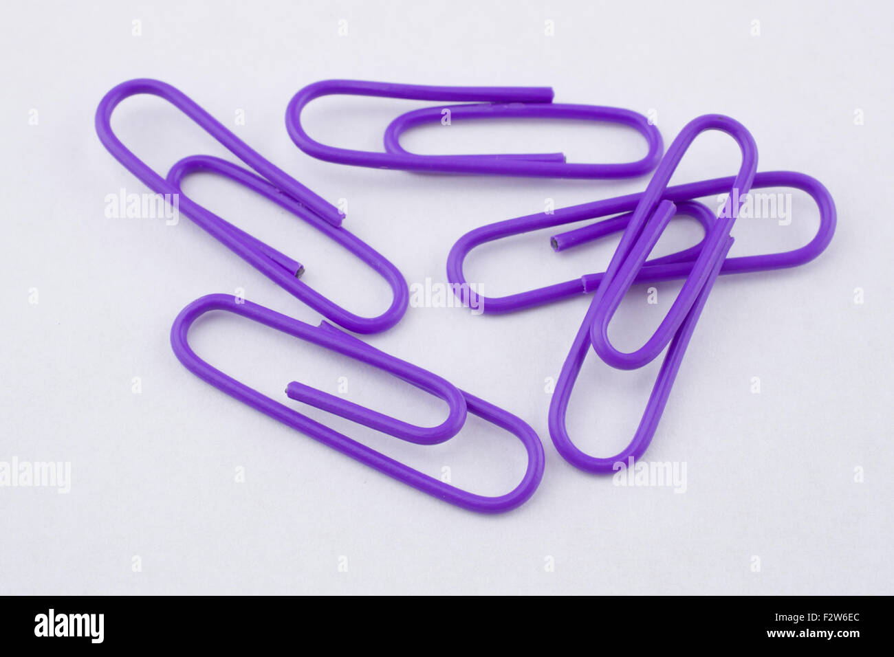 Paper clips on white background Stock Photo - Alamy