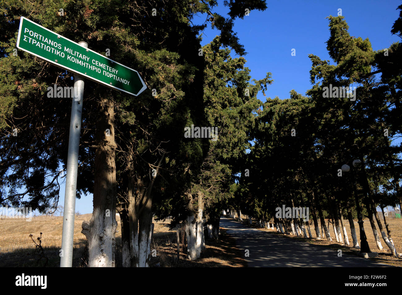 Recently installed bilingual green road traffic sign, pointing at the ...