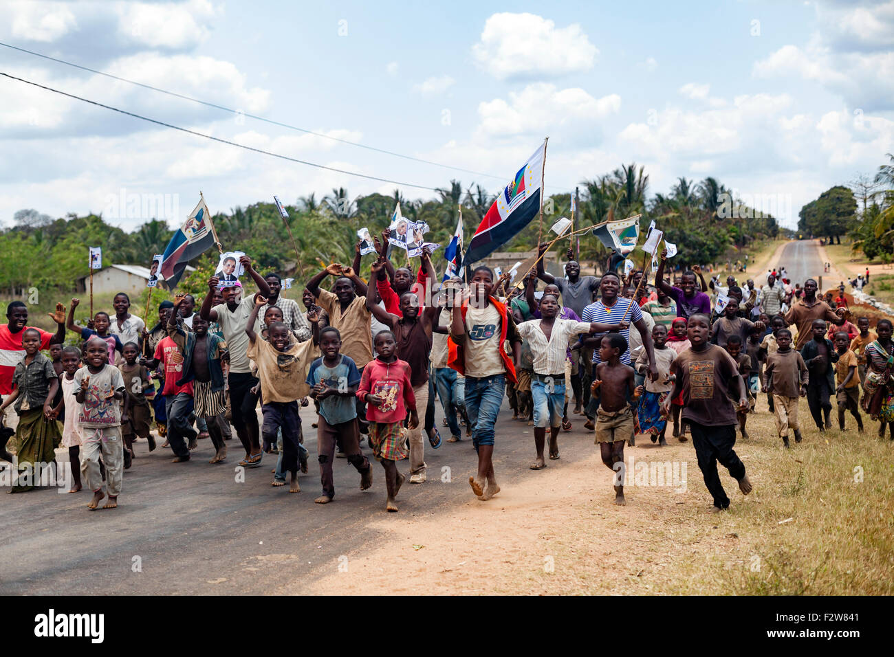 Youth activists and children running to attend a political rally of ...