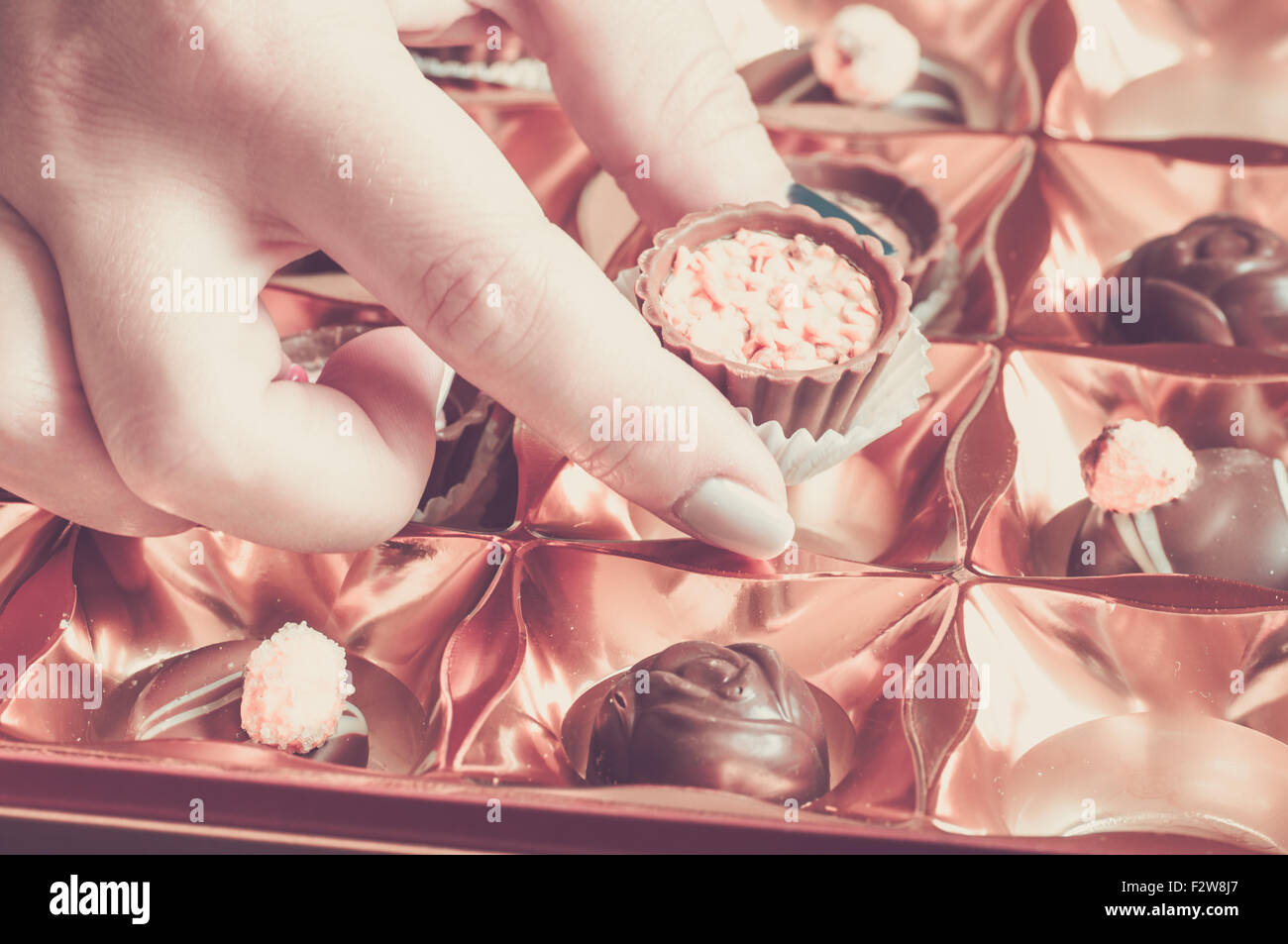 Hand holding chocolate box hi-res stock photography and images - Alamy