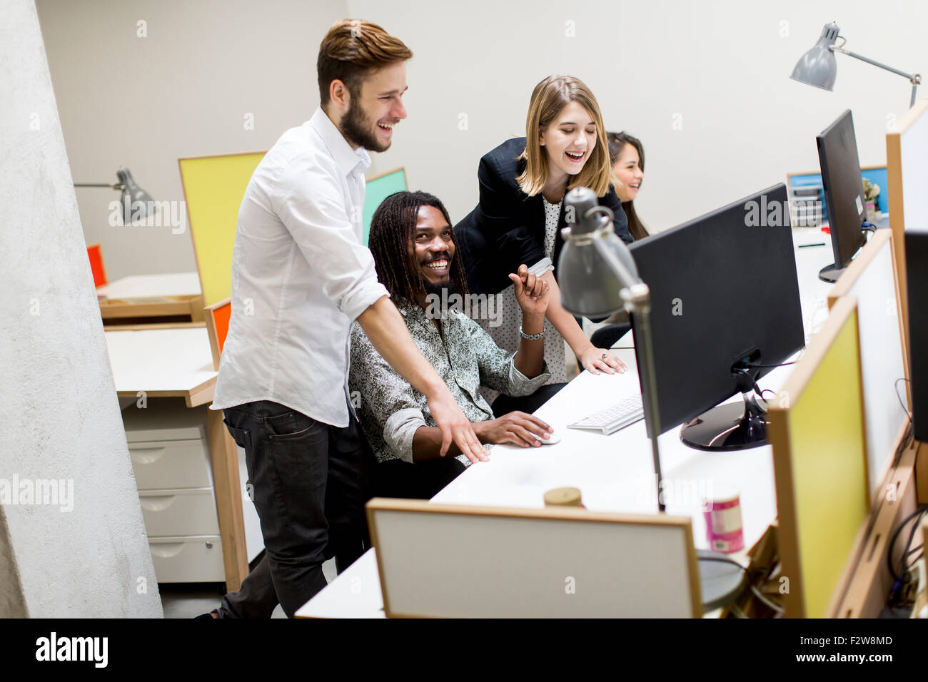 Young people in the office Stock Photo - Alamy