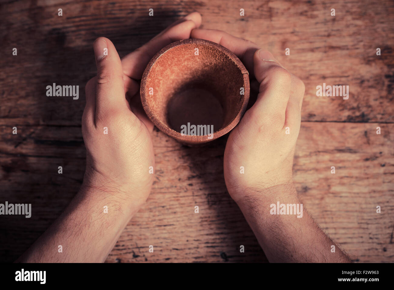 Male hand holding empty cup hi-res stock photography and images - Alamy