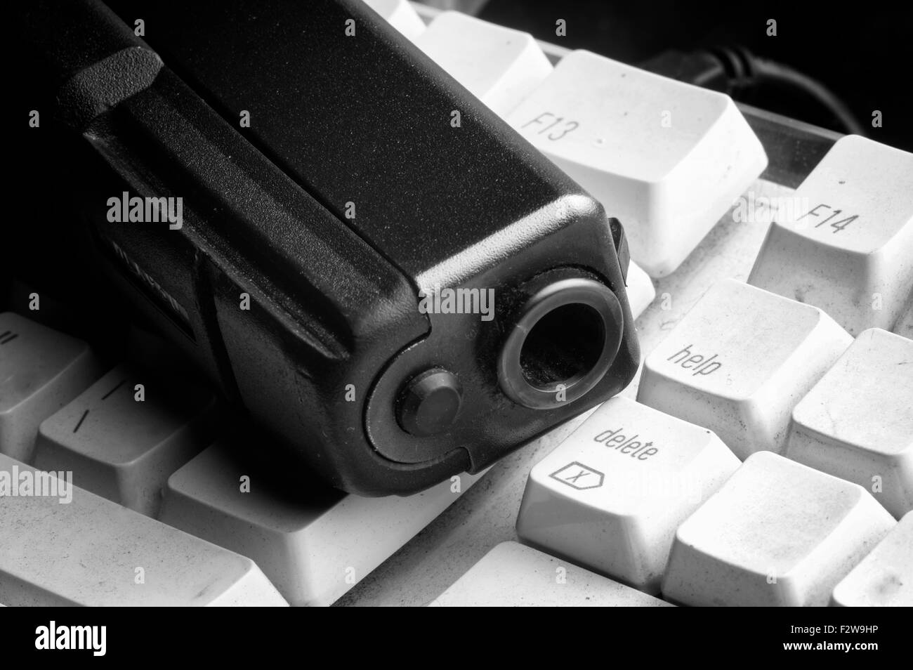 Gun On Computer Stock Photo - Alamy