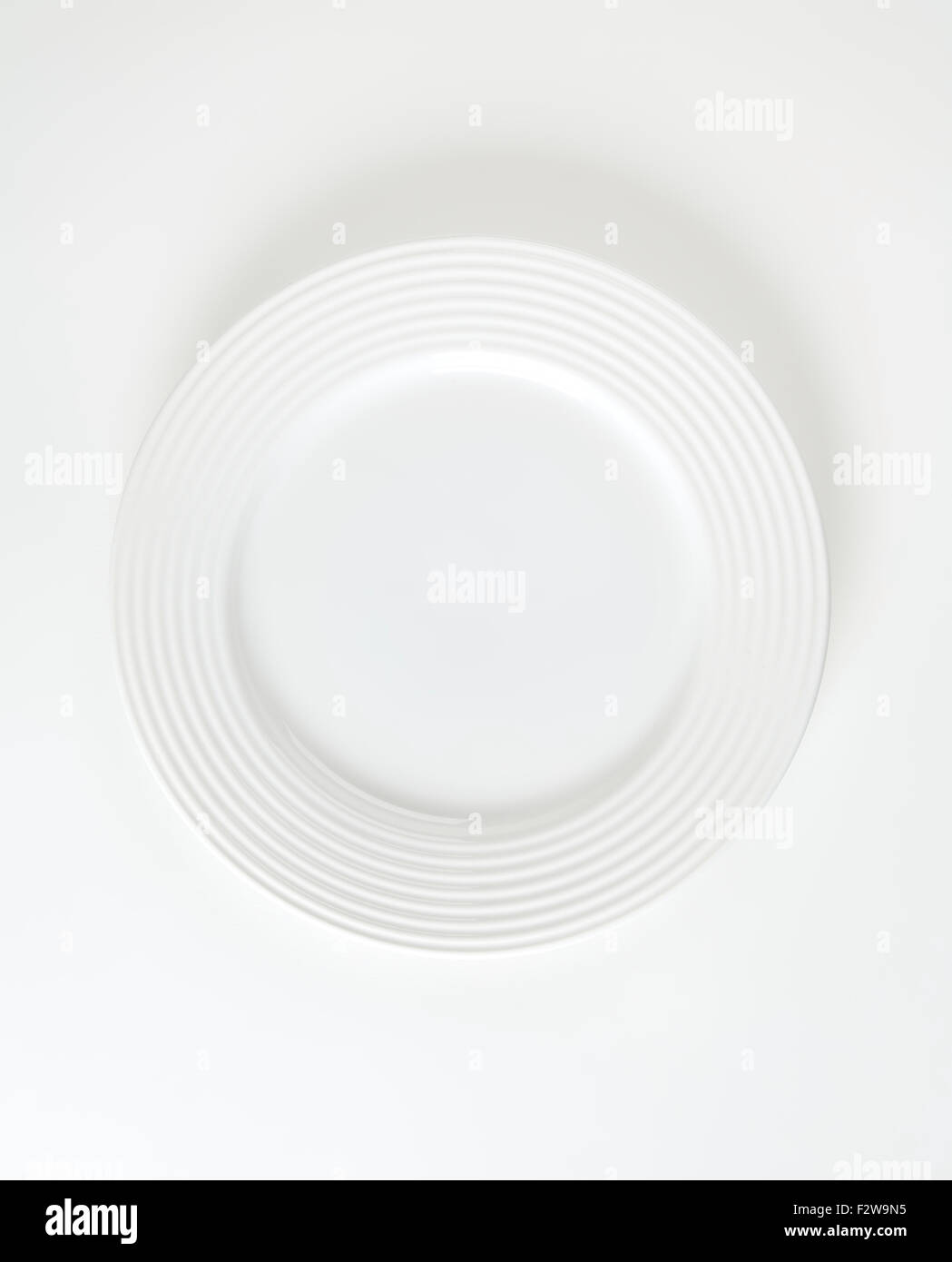 empty white plate on white background Stock Photo - Alamy