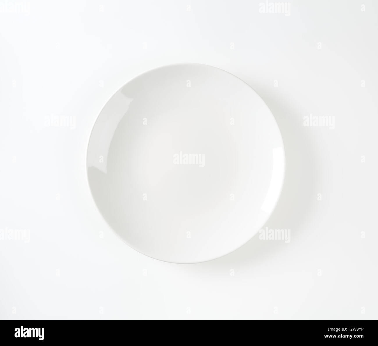 empty white plate on white background Stock Photo - Alamy