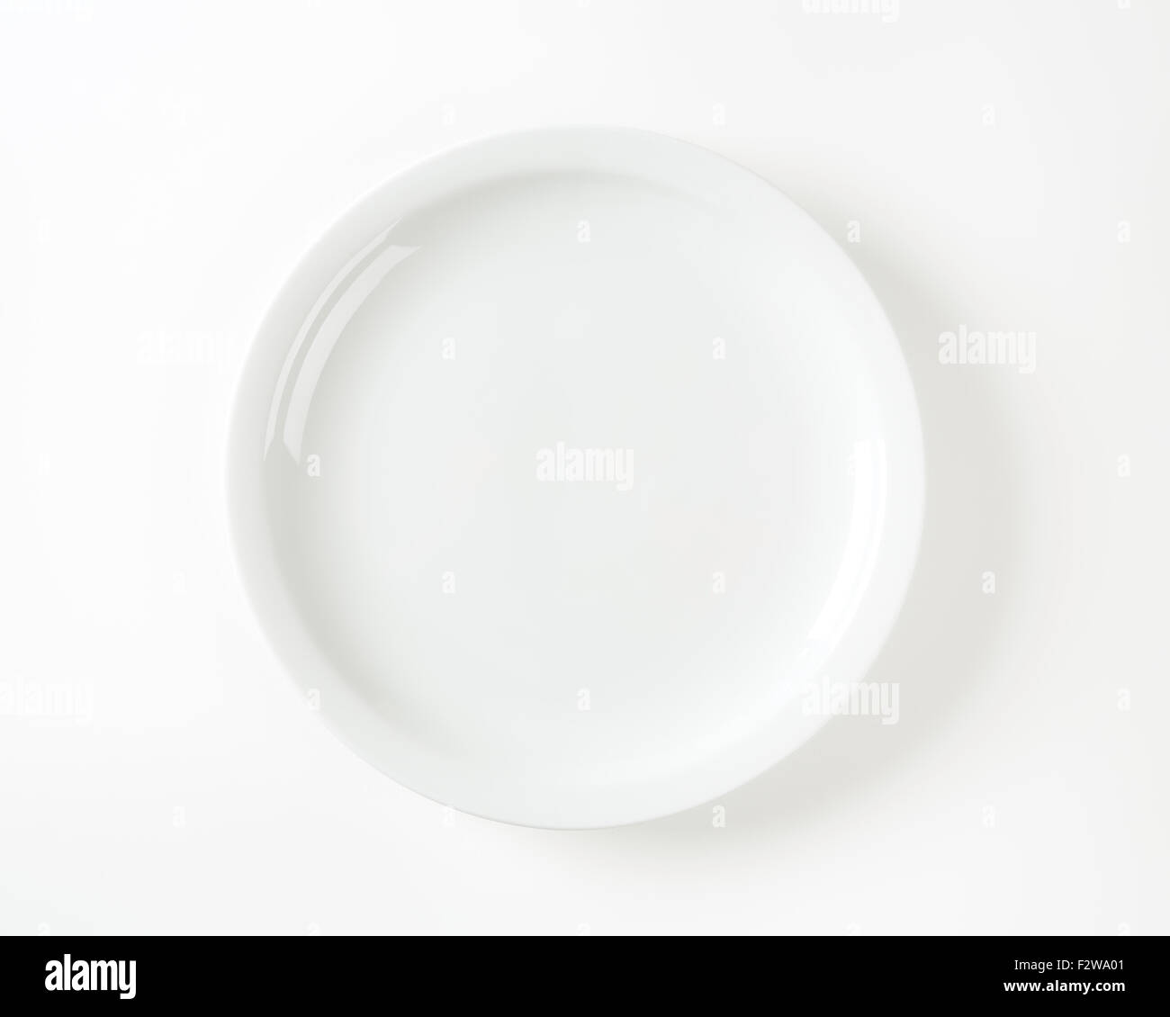 empty white plate on white background Stock Photo - Alamy